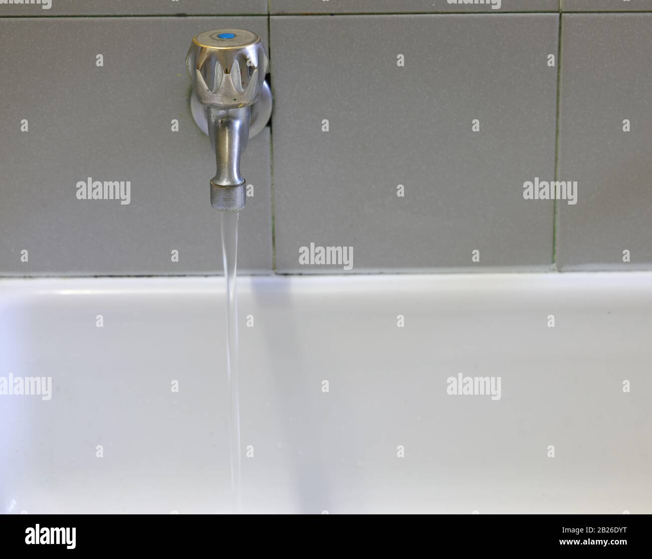 open steel tap with drinking water above the ceramic sink Stock Photo ...