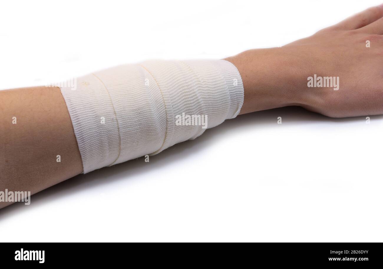 wide bandage with a sterile gauze on an arm of a young boy and the ...
