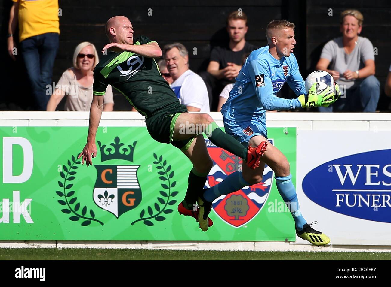 Elliot Justham of Dagenham and Redbridge denies Jason Kennedy of ...