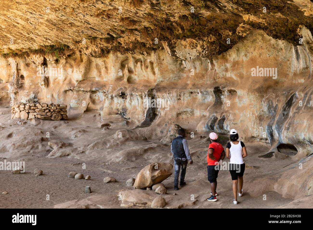 People looking at rock art in Liphofung Cave, Lesotho Stock Photo - Alamy