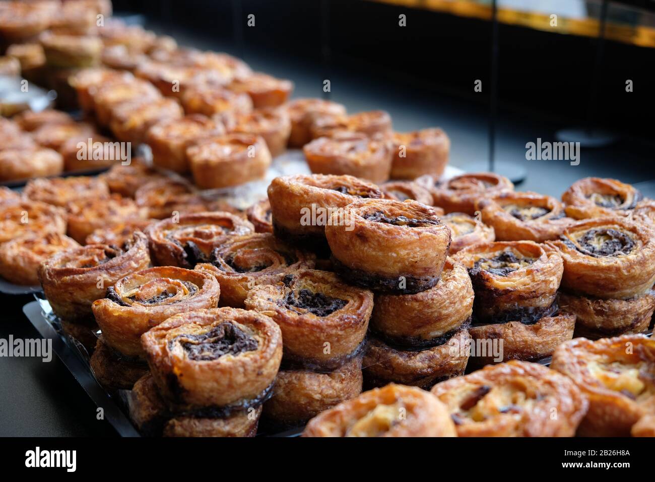 Round, fruity breakfast pastry goods on display Stock Photo - Alamy
