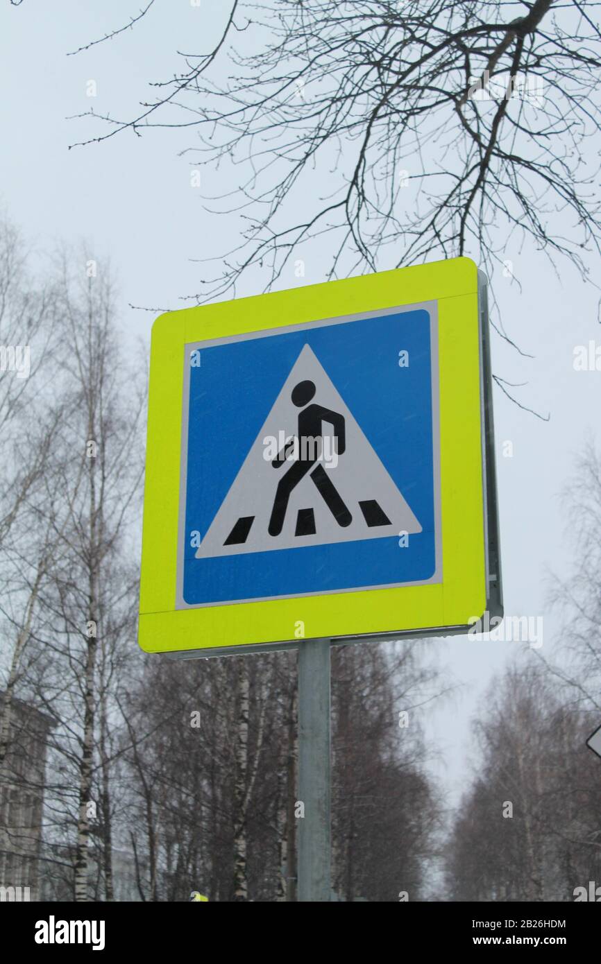 Road sign in the Russian city in the winter. Pedestrian crossing sign ...