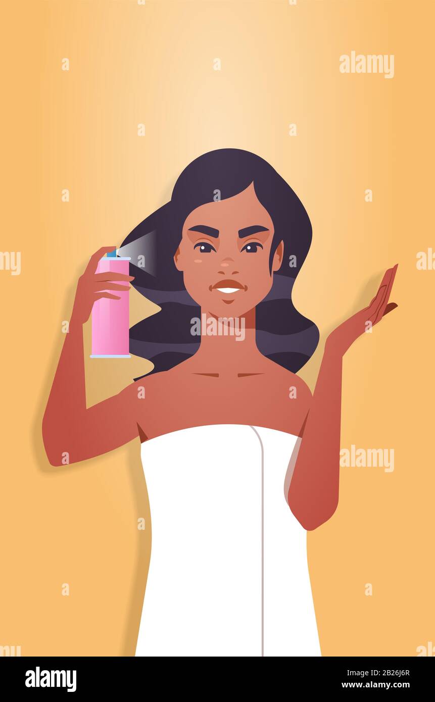 young woman applying hair spray dressed in towel african american girl ...