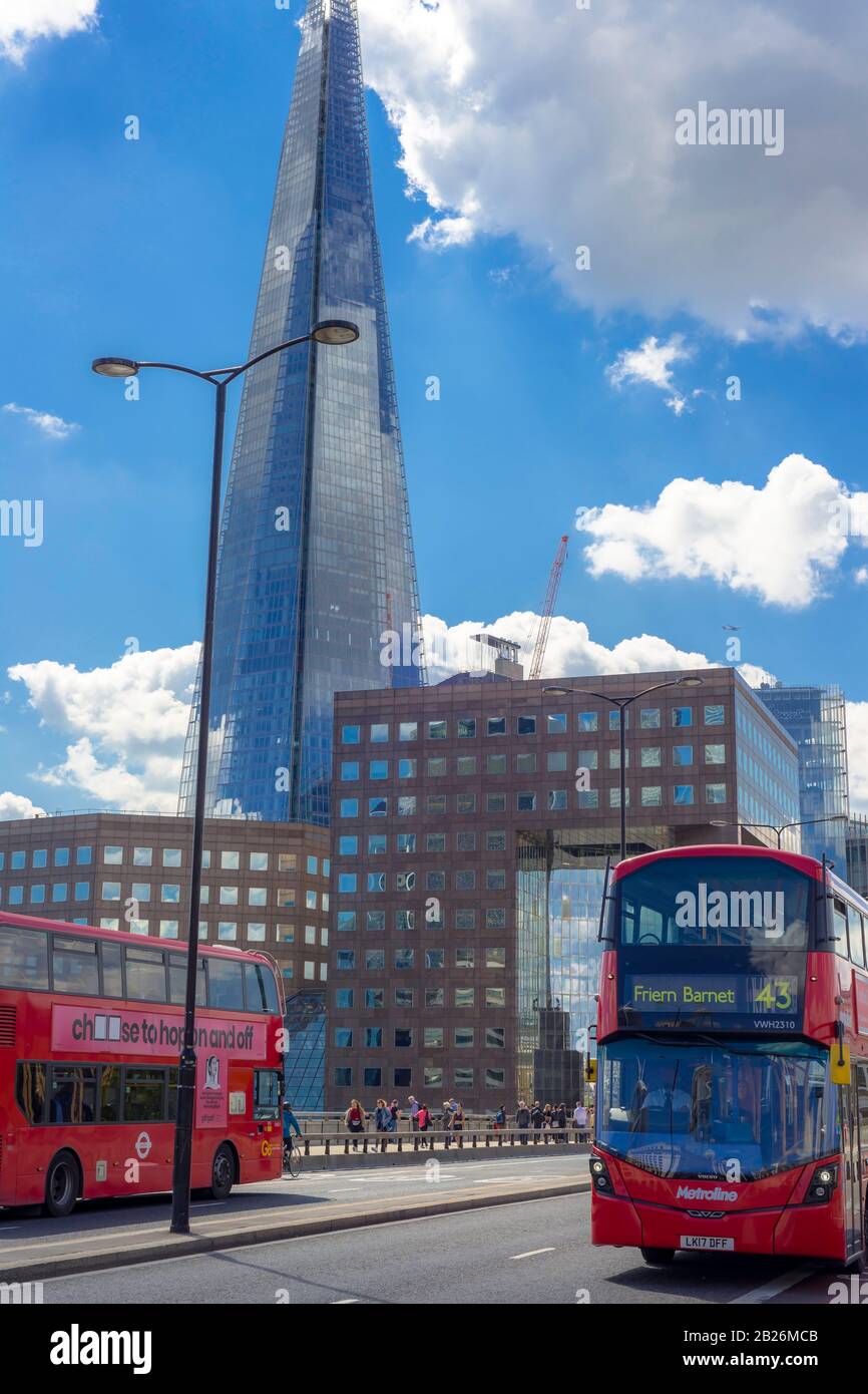 Bus pass London bridge at the Shard, London, UK Stock Photo - Alamy