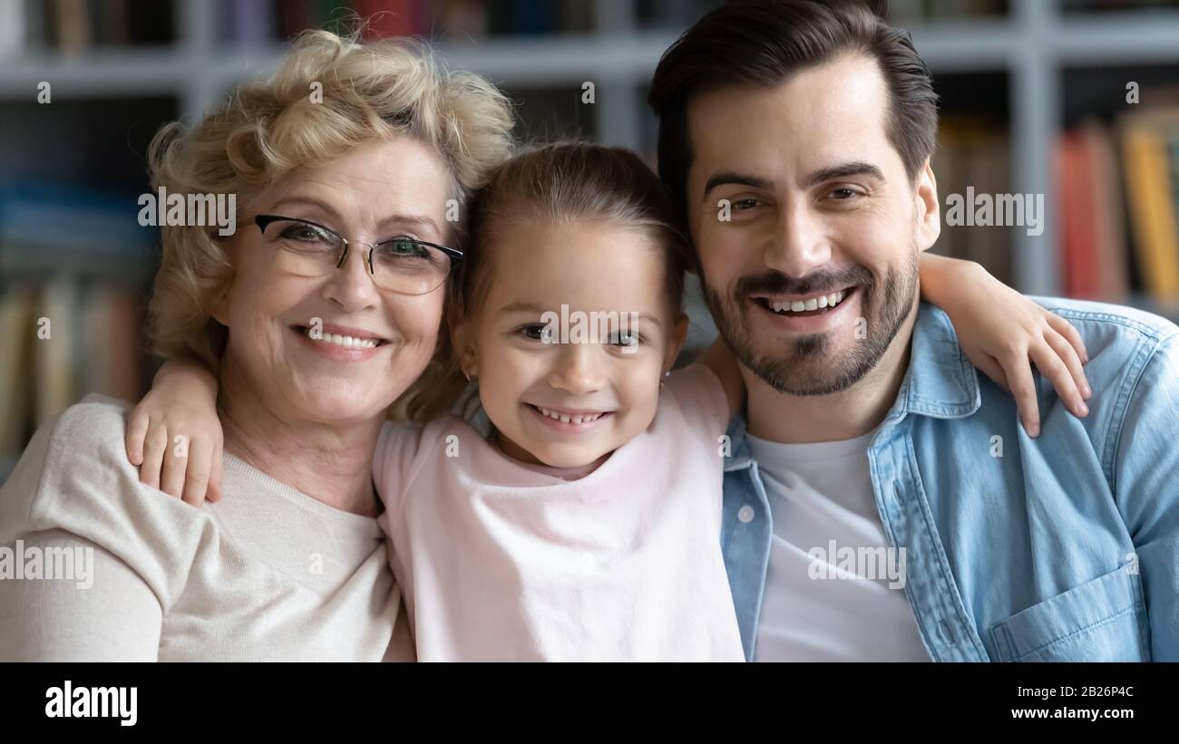 Portrait of three family generations posing together Stock Photo - Alamy