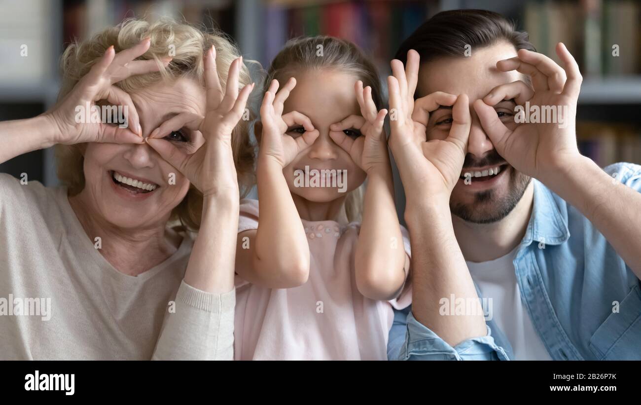 Portrait of happy three family generations posing together Stock Photo ...