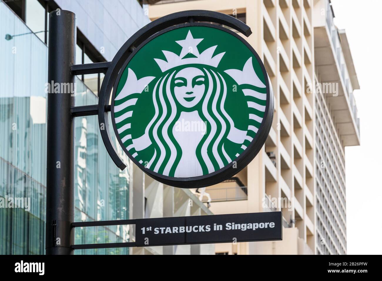 Starbucks sign indicating the 1st such coffee shop to open in Orchard ...