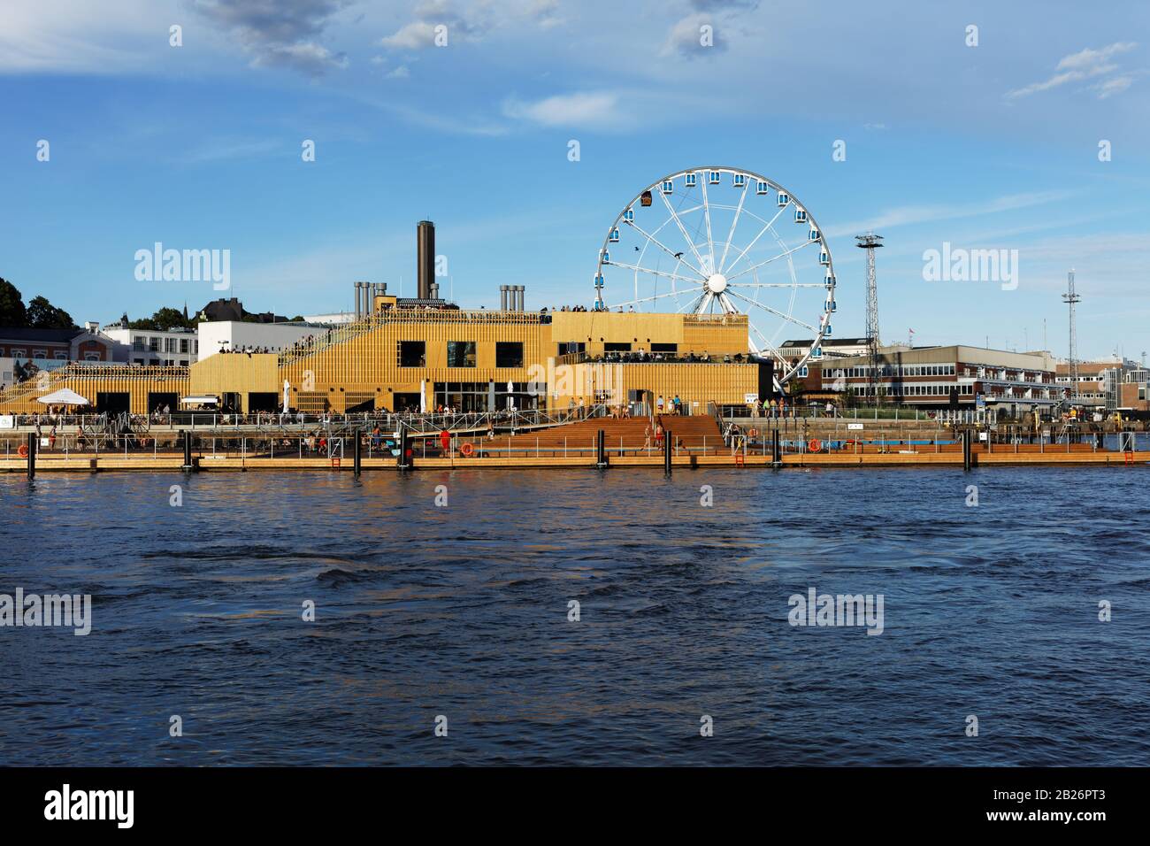 People resting at the outdoor swimming pool in South Harbor against ...