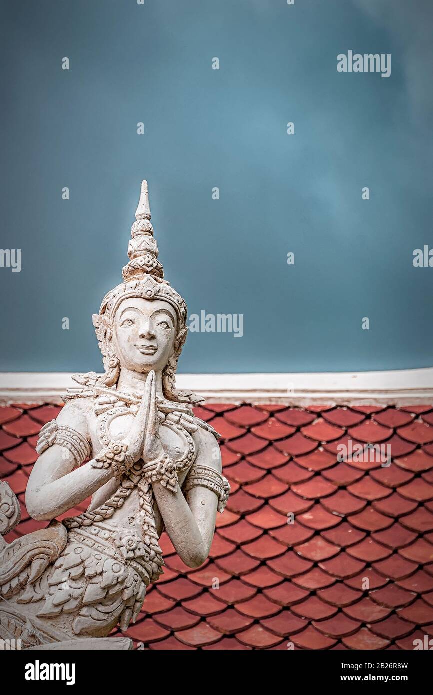 Ornate statue on the roof gable end of a temple in Thailand Stock Photo ...