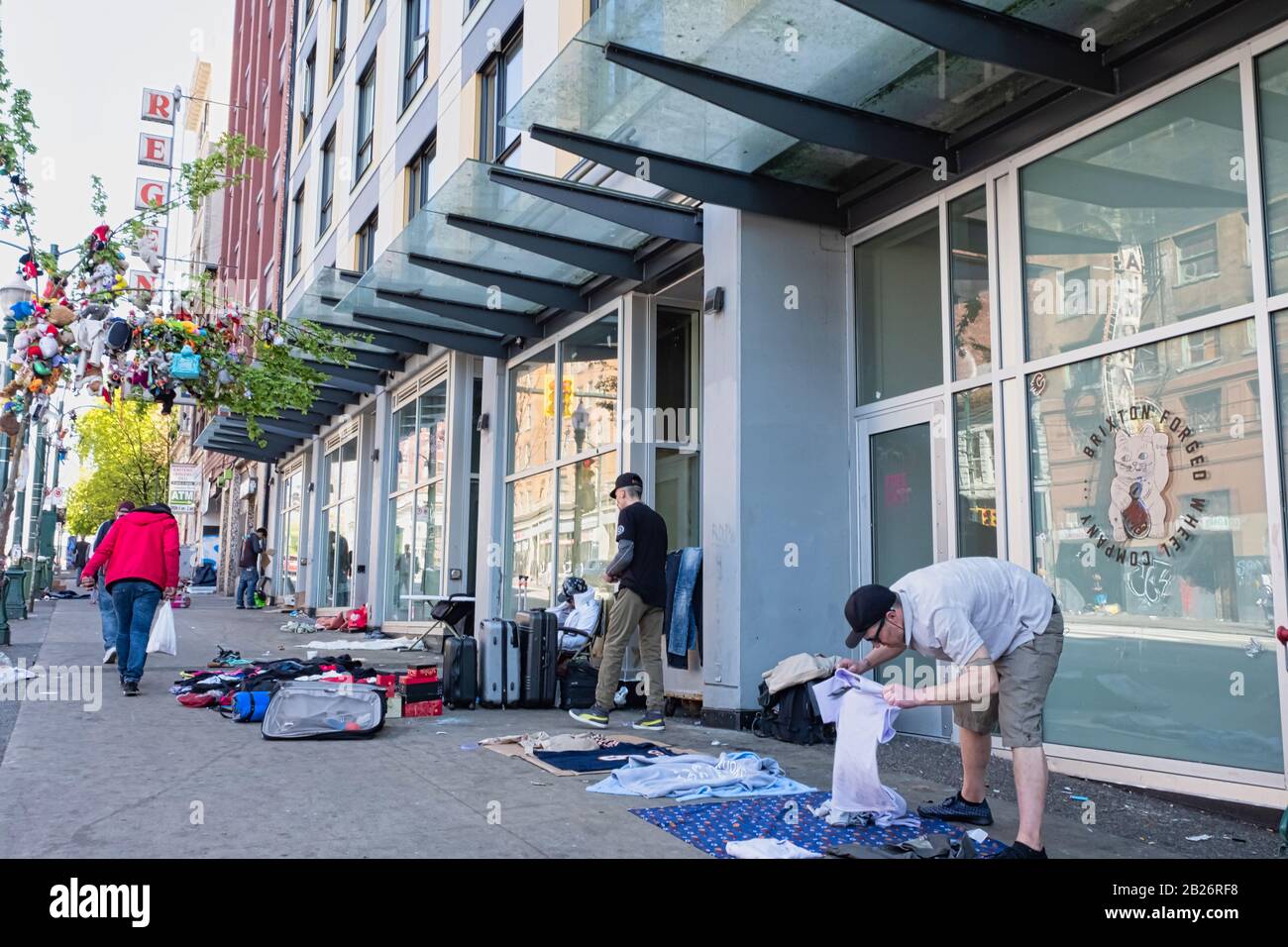 Homeless man laying sidewalk hi-res stock photography and images - Alamy
