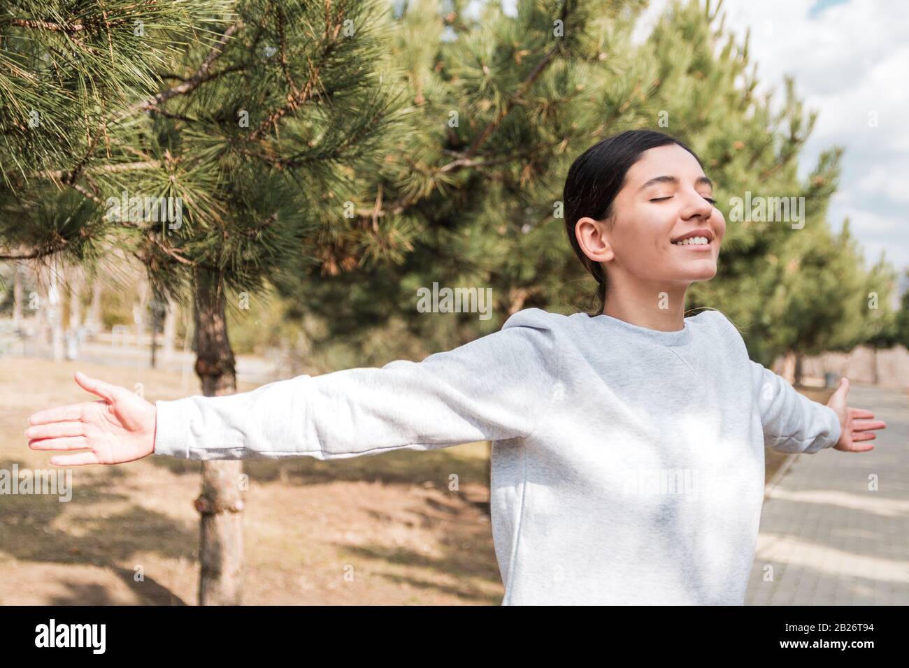 healthy lifestyle. cheerful attractive woman doing exercises and ...