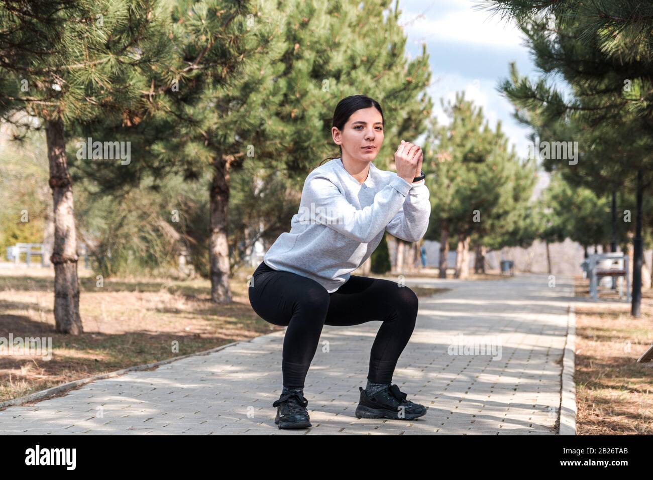 healthy lifestyle. cheerful attractive woman doing exercises and ...