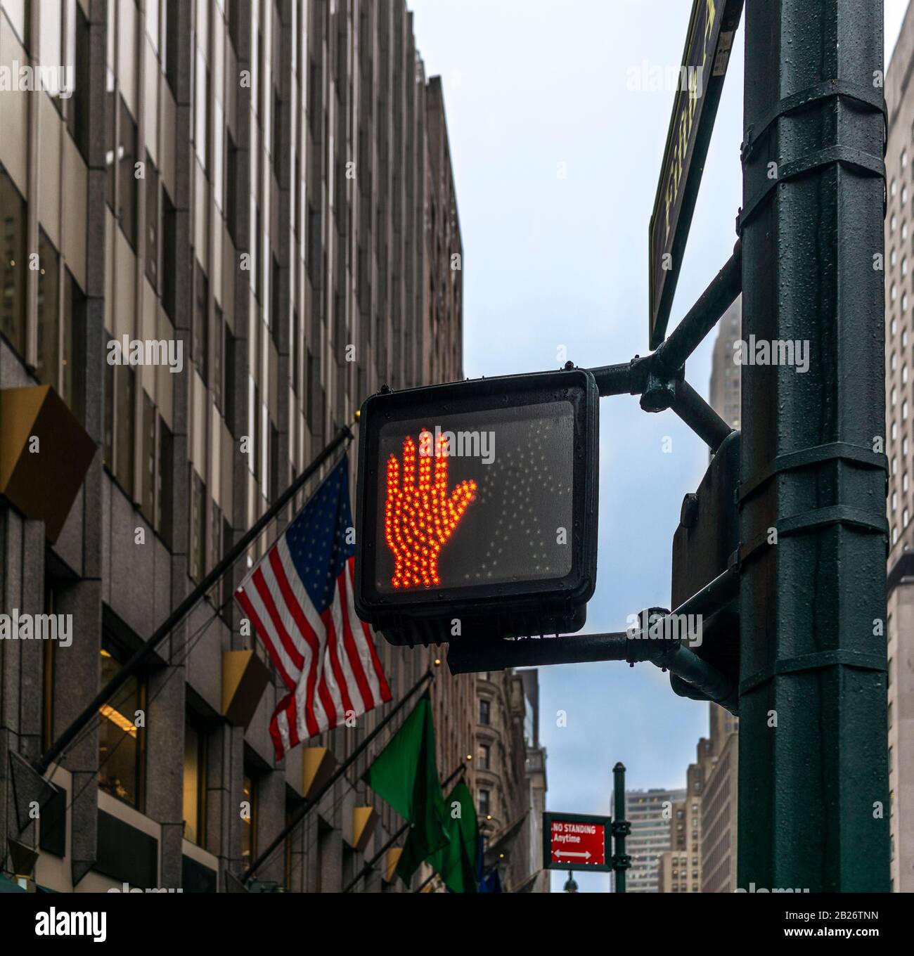A pedestrian crossing signal for stopping on Fifth Avenue in New York ...