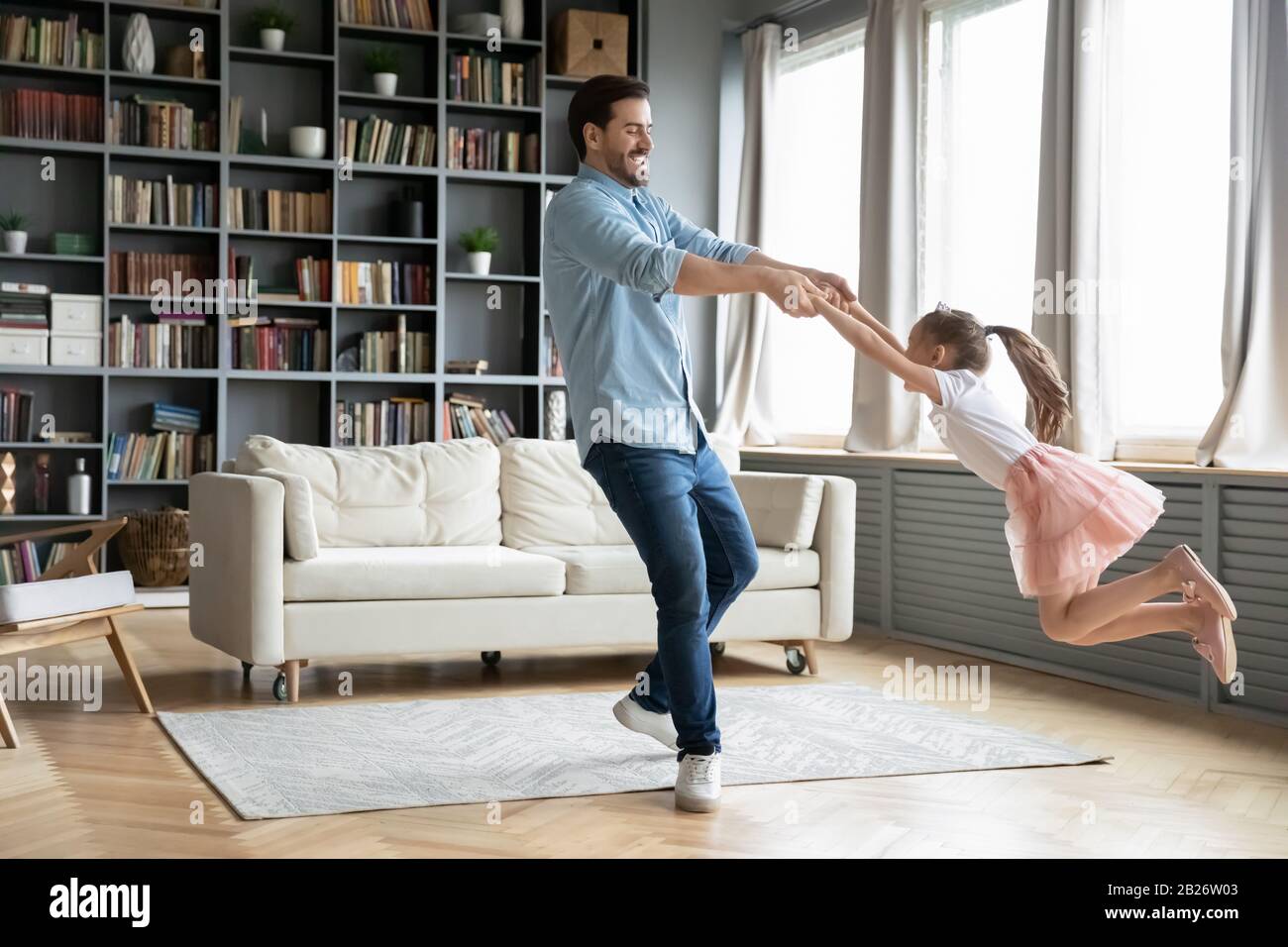 Young father dancing with happy preschooler daughter Stock Photo - Alamy