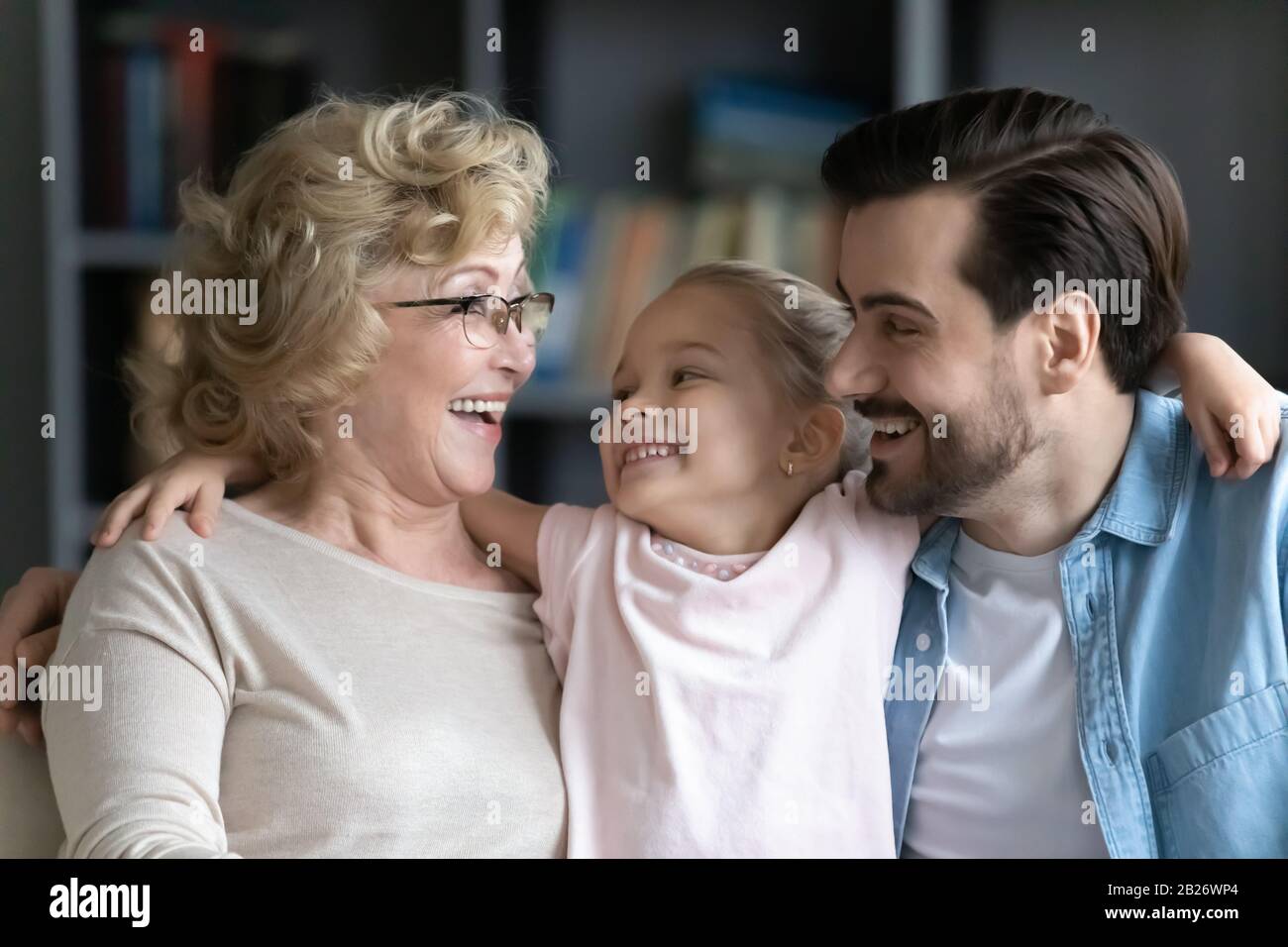 Happy three family generations relax at home together Stock Photo - Alamy