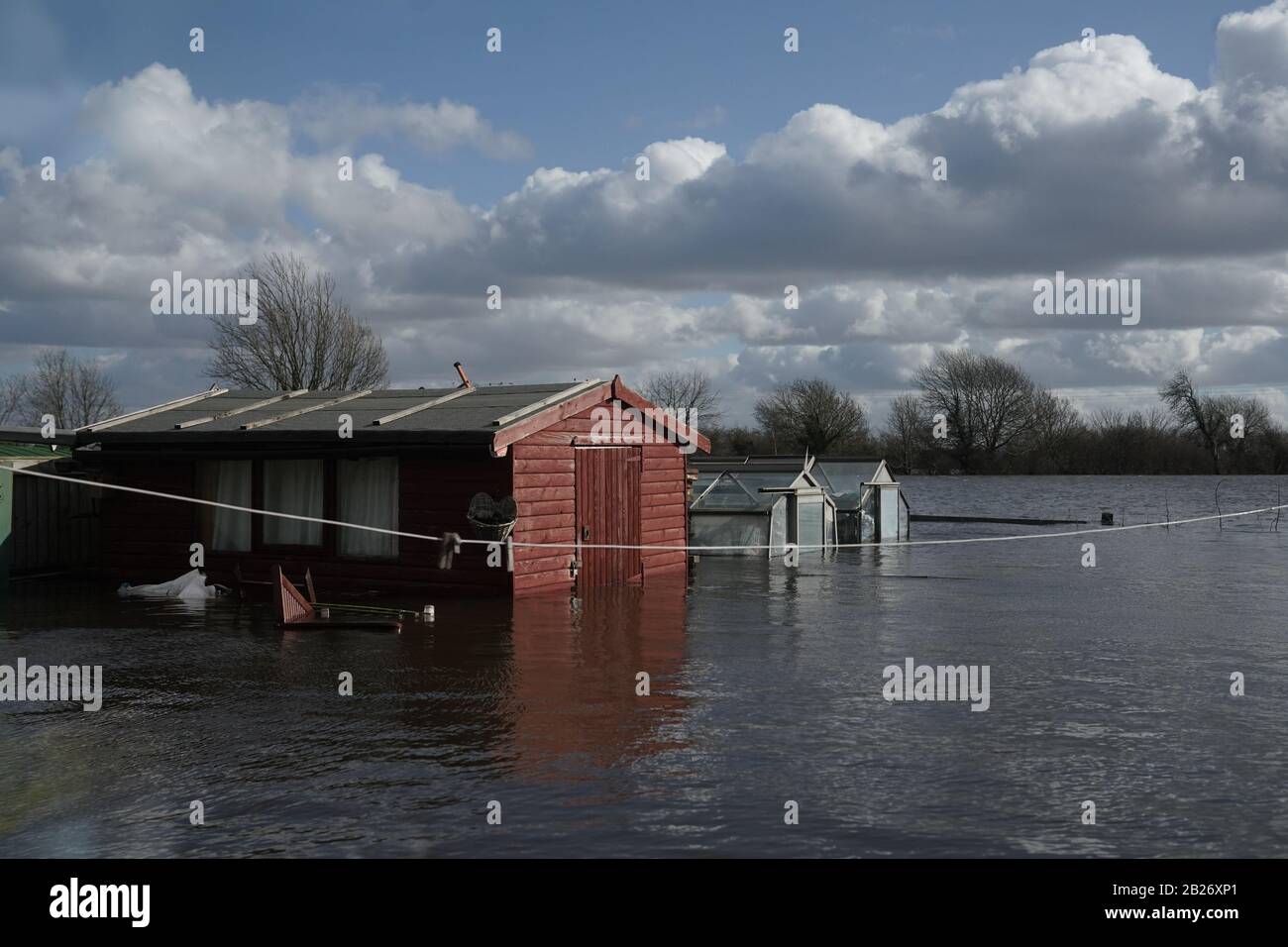 Houses are surrounded by water in the flooded village of East Cowick ...