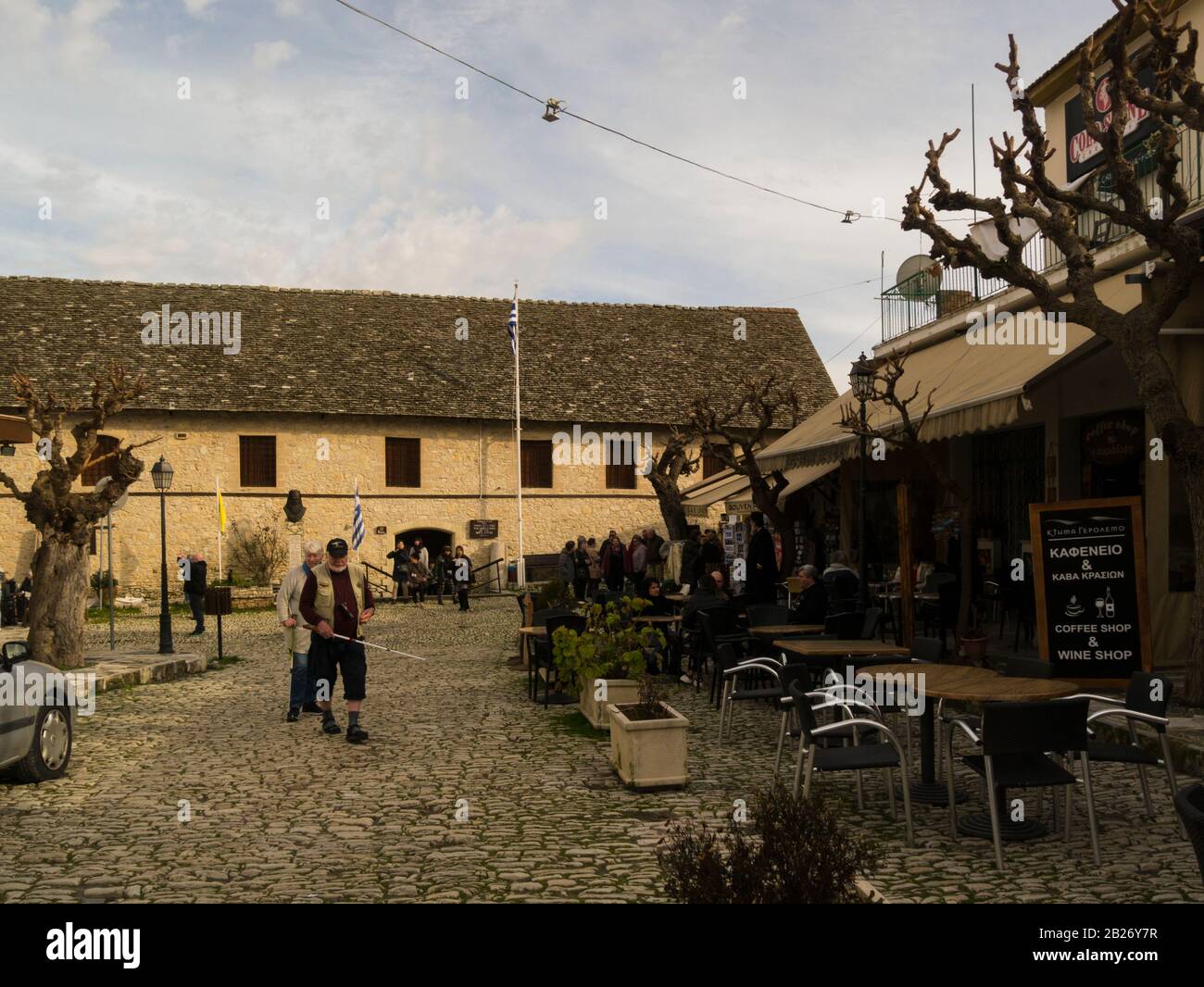 View along cobbled street to entrance to Monastery of Holy Cross with ...