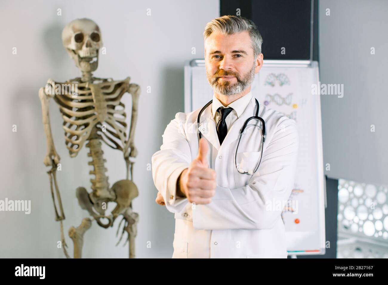 smiling doctor or professor with stethoscope Stock Photo - Alamy