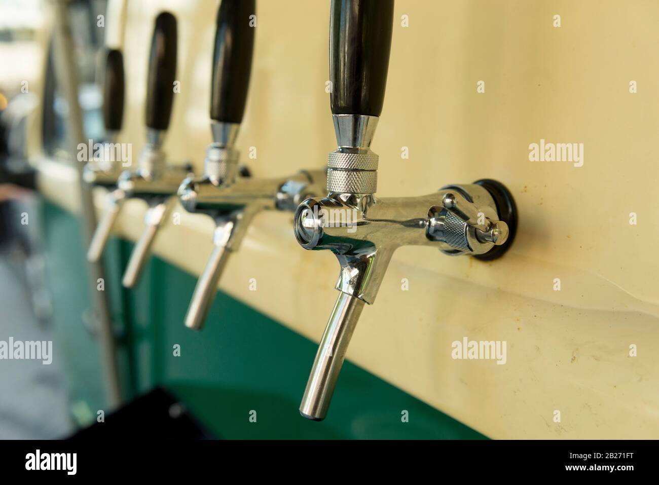 The beer taps in a side of a vintage van. nobody. Selective focus ...