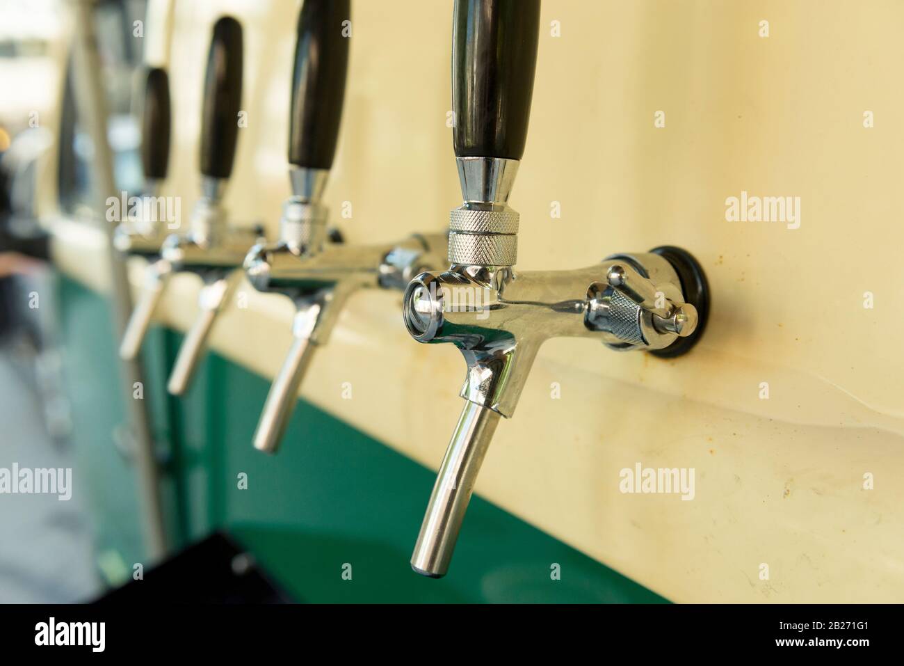 The beer taps in a side of a vintage van. nobody. Selective focus ...