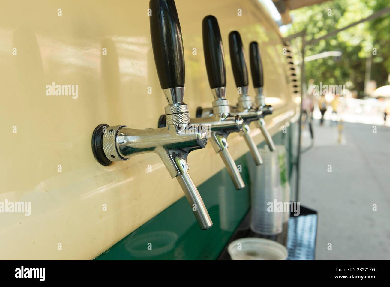 The beer taps in a side of a vintage van. nobody. Selective focus ...