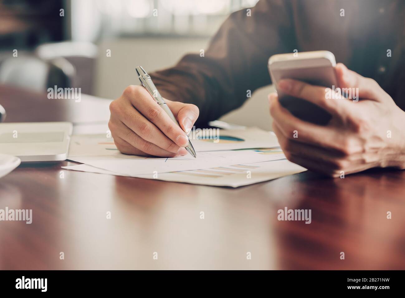 business man hand writing note paper on wooden table Stock Photo - Alamy