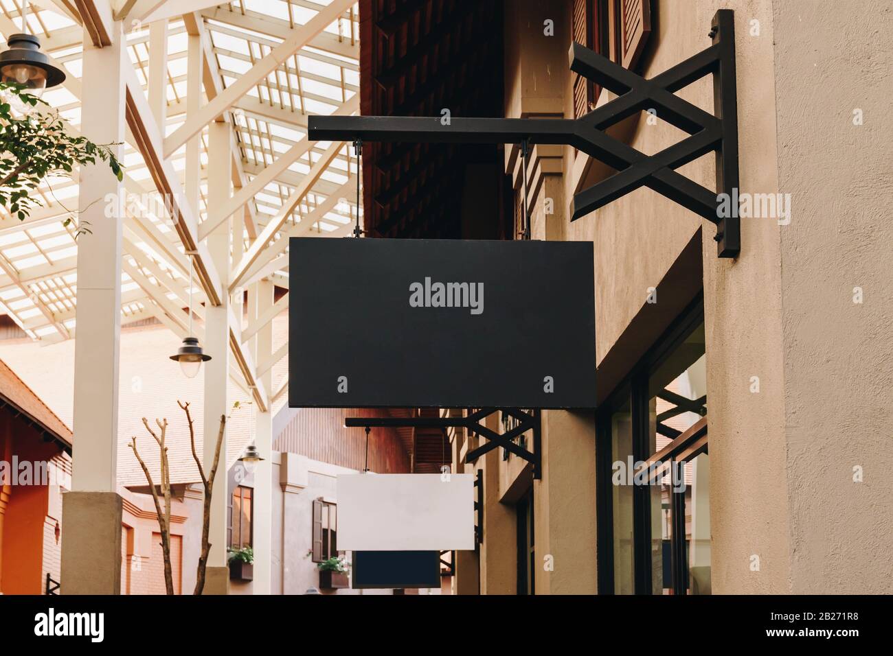 horizontal black empty signage on clothes shop front with copy space ...