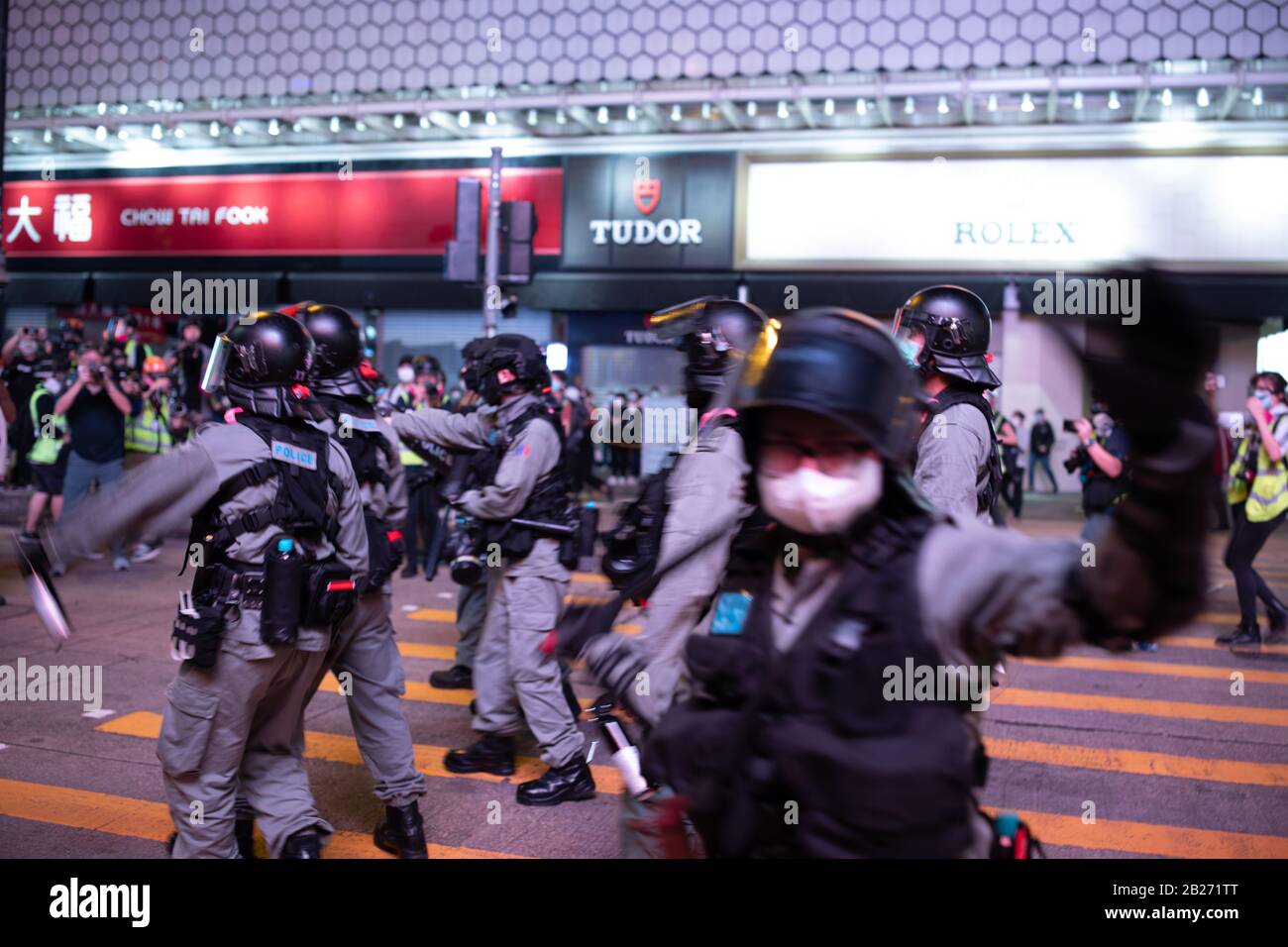 Police with batons hi-res stock photography and images - Alamy