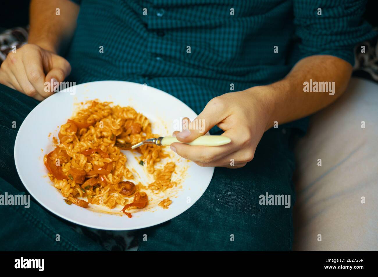 Man eats. Human eats lunch after work Stock Photo - Alamy