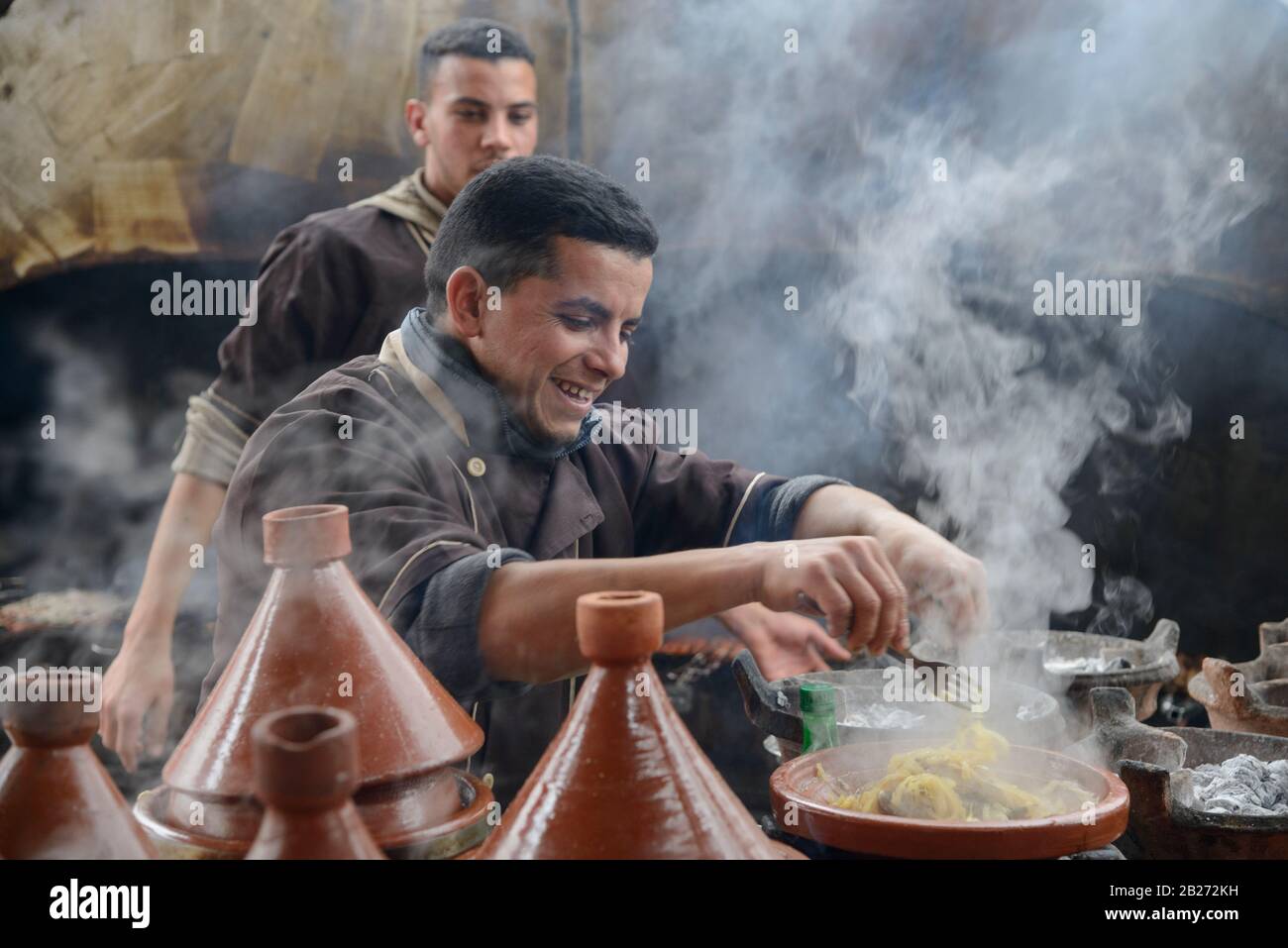 The process of cooking traditional Moroccan tajin dishes. This is tajin ...