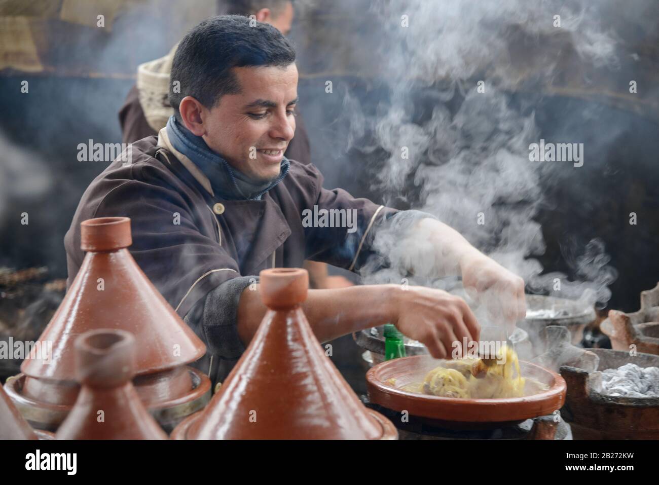 The process of cooking traditional Moroccan tajin dishes. This is tajin ...