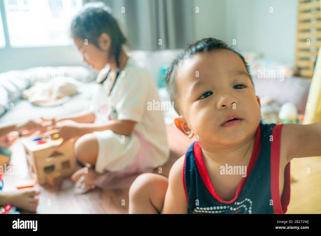 Group of lottle kid friend playing toy together in cozy room Stock ...