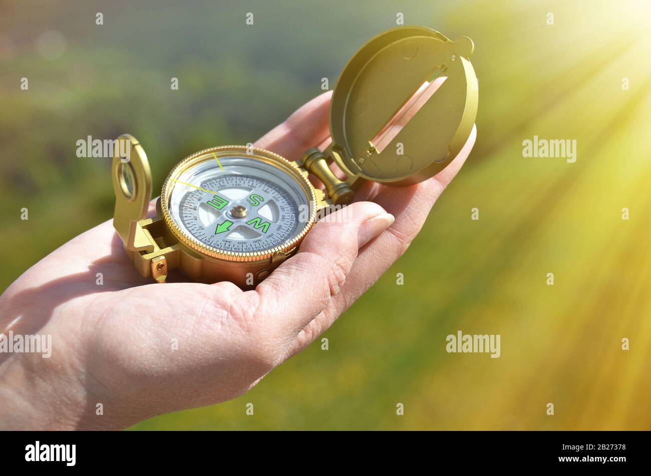 Compass in the hand Stock Photo - Alamy