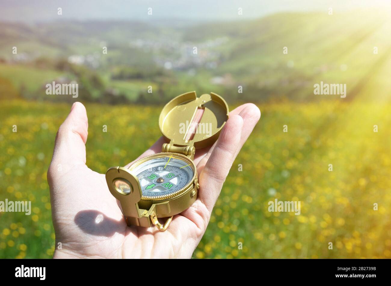 Compass in the hand Stock Photo - Alamy
