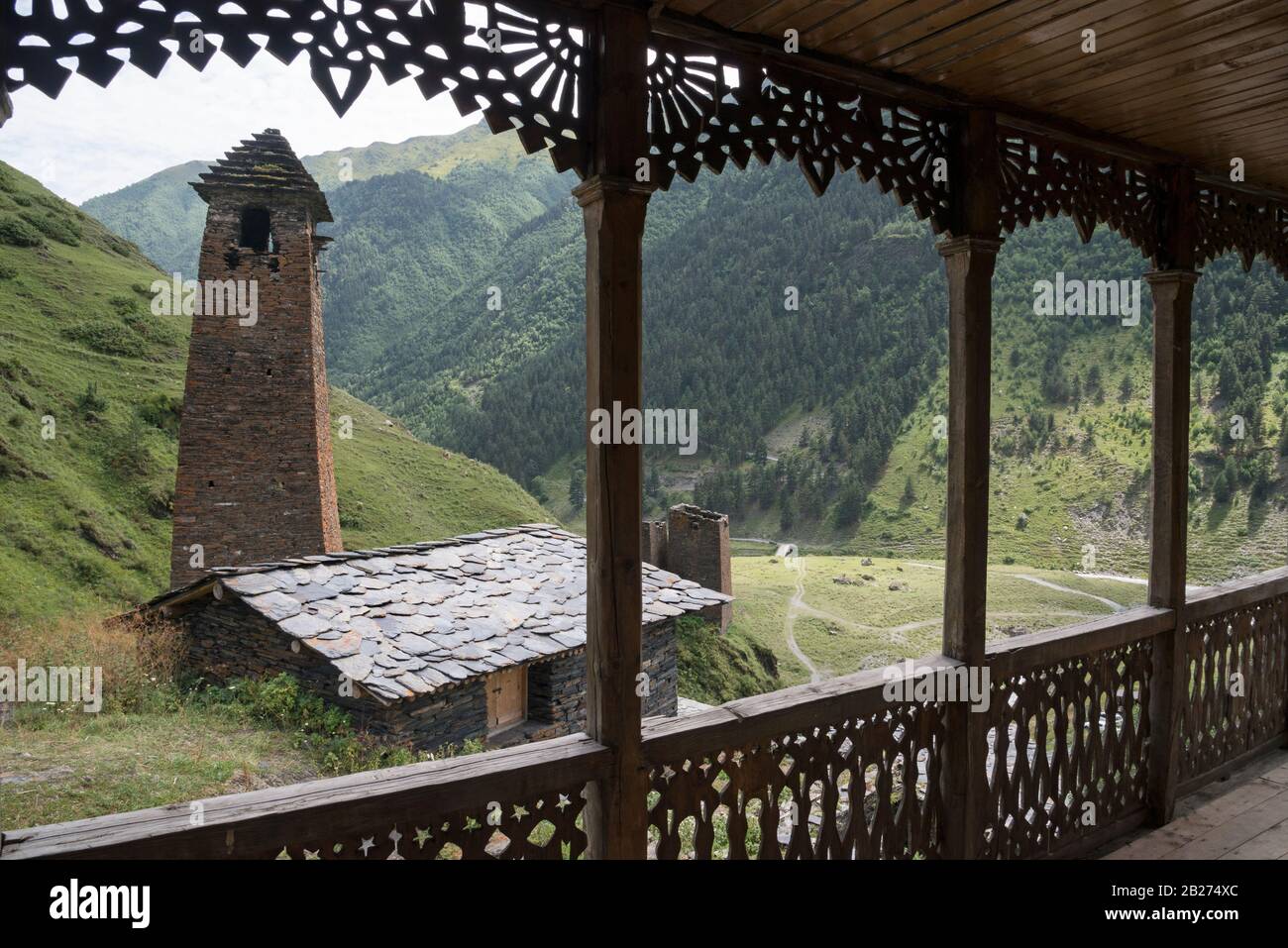 Wooden and stone architecture of Tusheti against green mountains ...