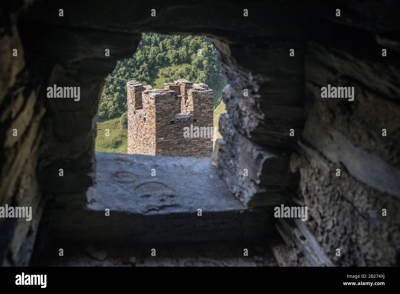 Tower Mutso fortress view through a small window Stock Photo - Alamy