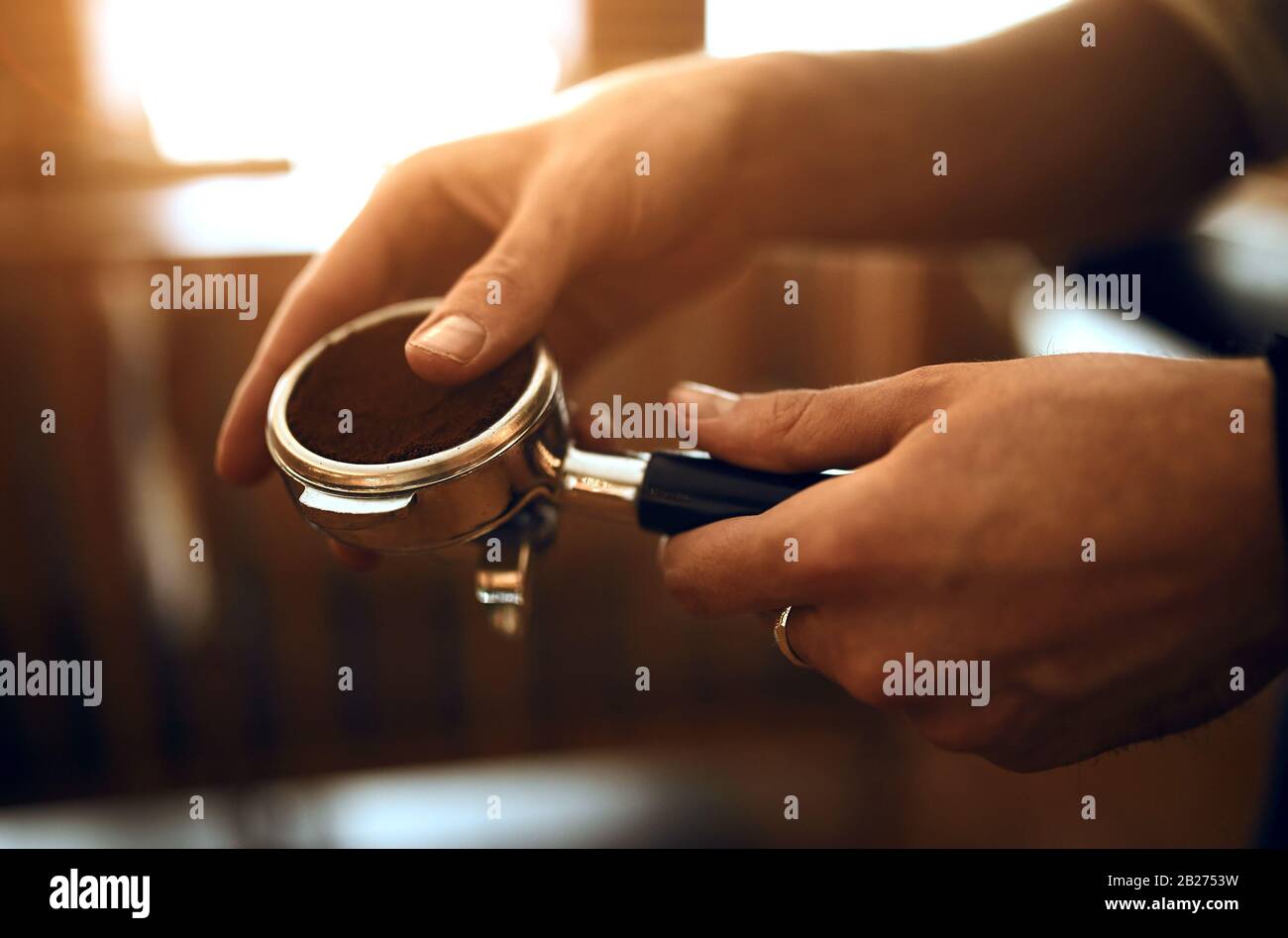 barista grounding coffee beans . close up side view photo, secret of ...