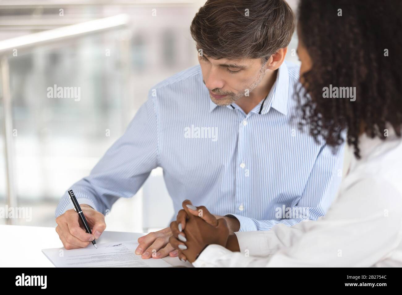 Image of man putting signature signing paper at meeting concept Stock ...