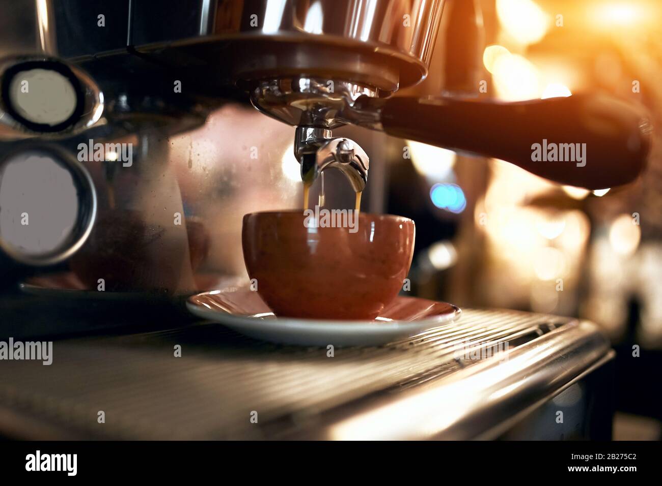 modern black espresso making machine brewing coffee, close up side view ...