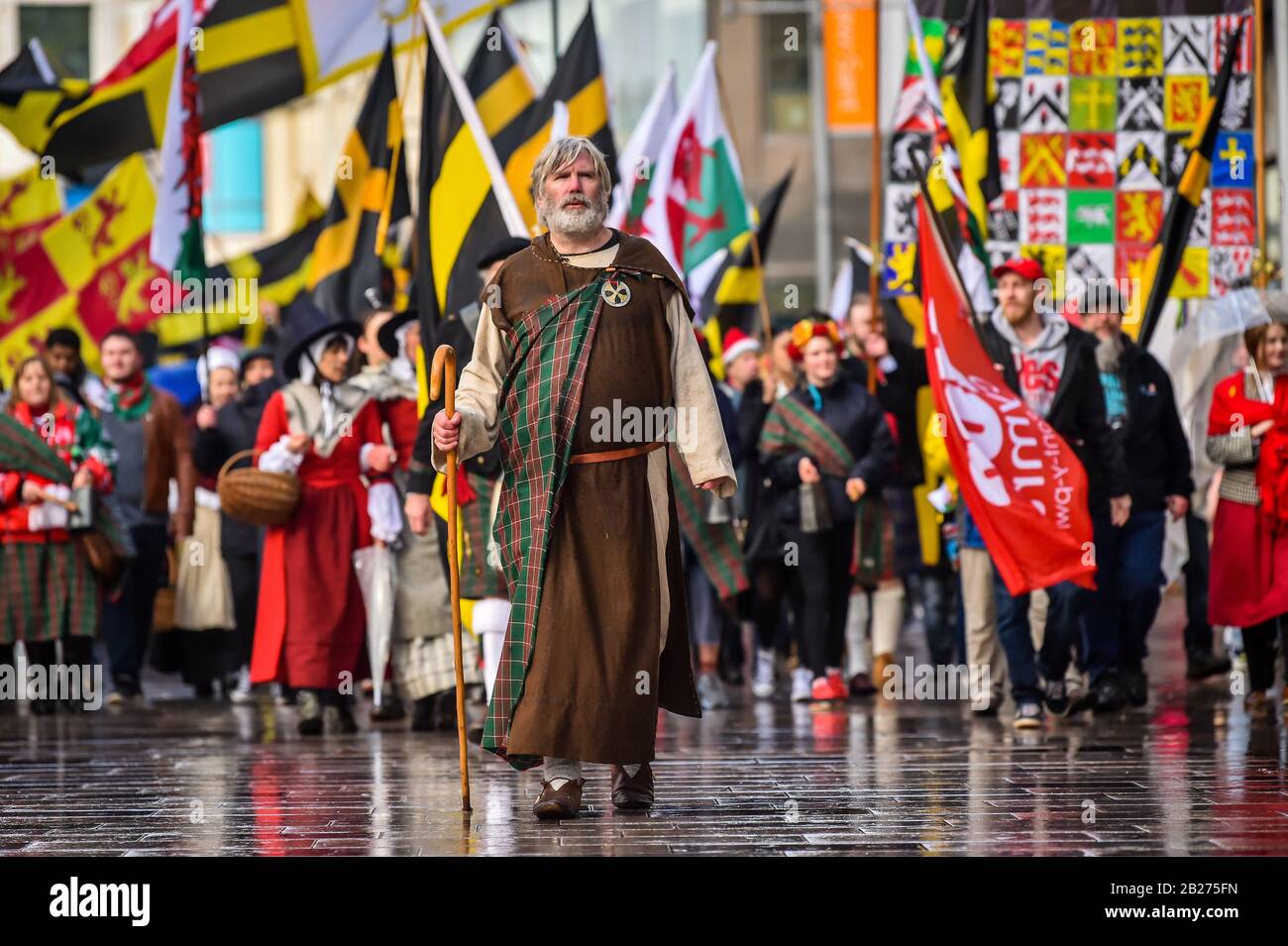 A man dressed as Dewi Sant leads the St David's day parade in Cardiff ...