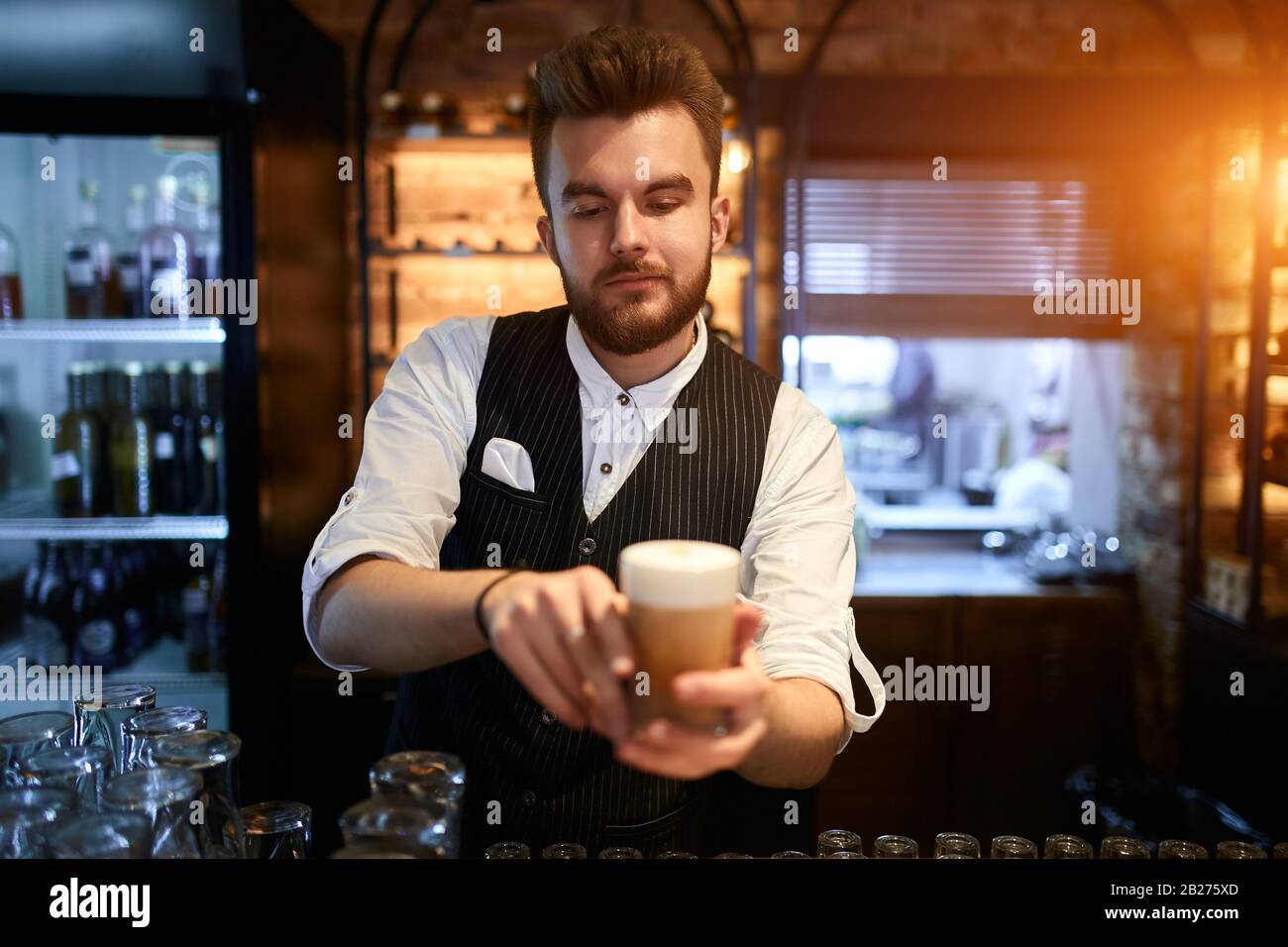 Barista bar serves coffee in hi-res stock photography and images - Alamy