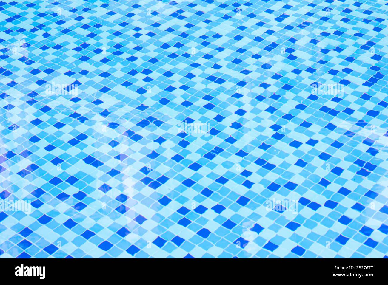 Ripple Water in swimming pool with blue tile floor background Stock ...