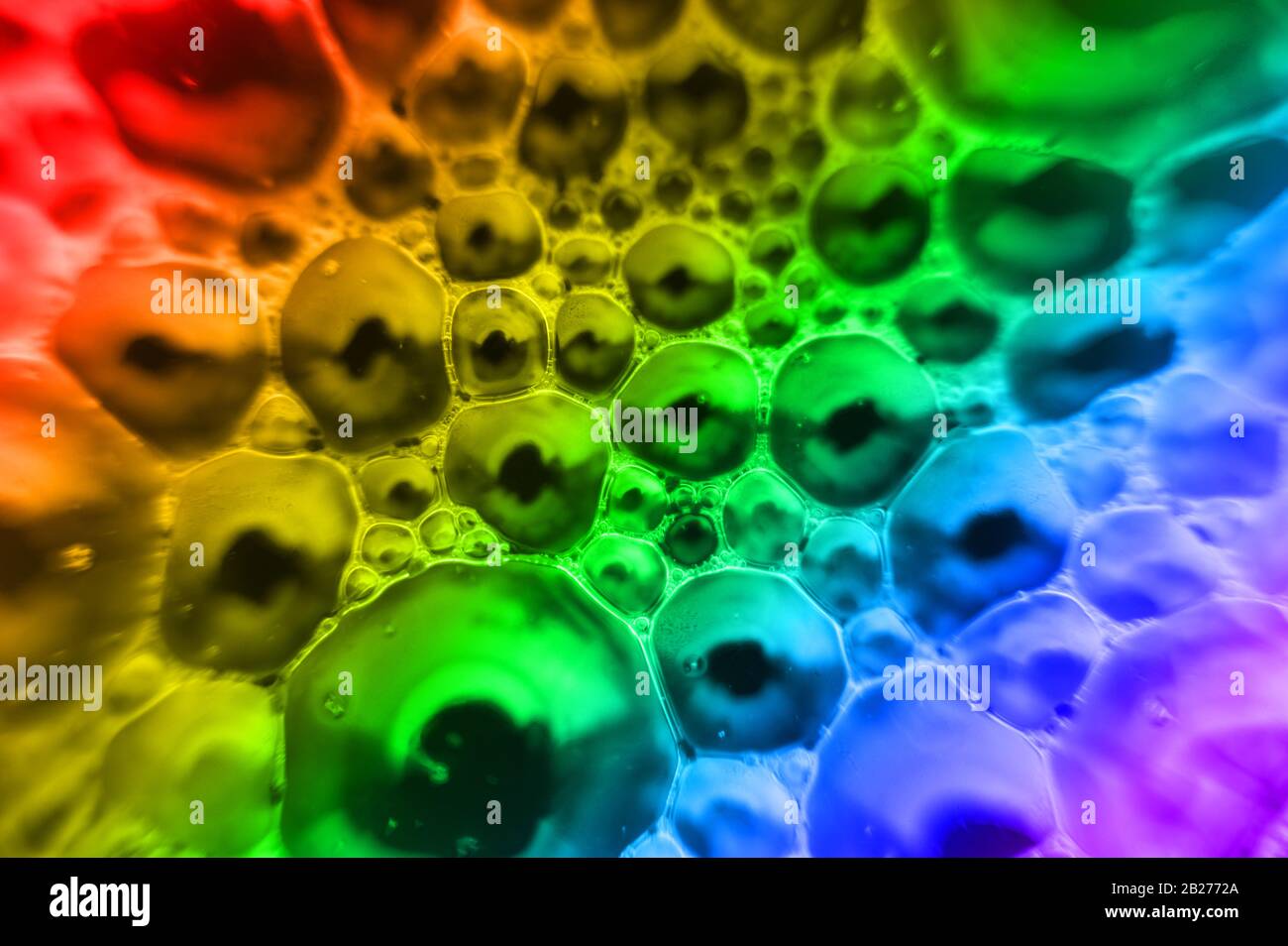 multicolored bubble pattern as a foam structure on a liquid surface ...