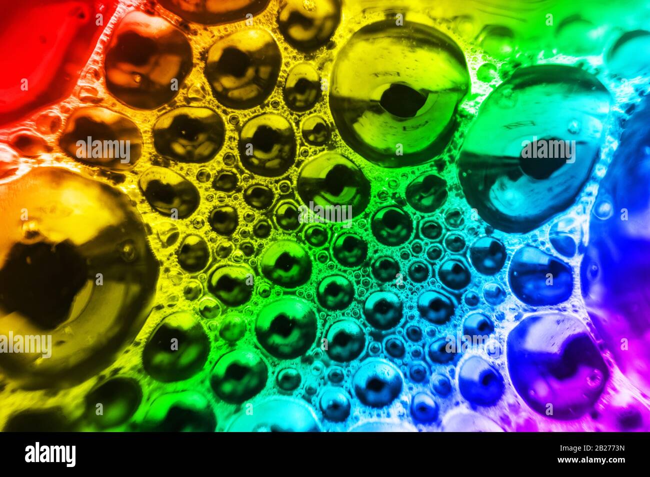 multicolored bubble pattern as a foam structure on a liquid surface ...