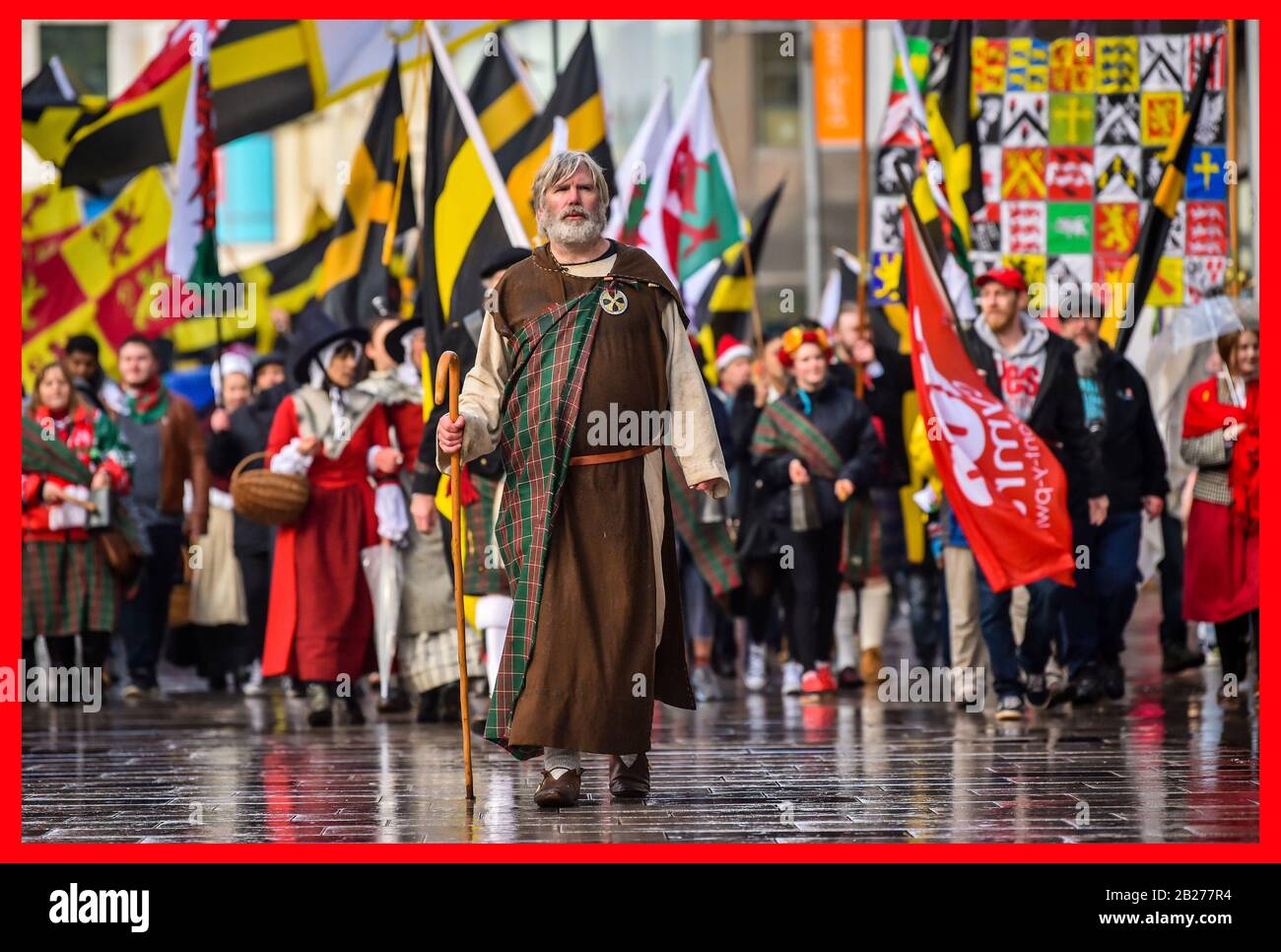 A man dressed as Dewi Sant leads the St David's day parade in Cardiff ...