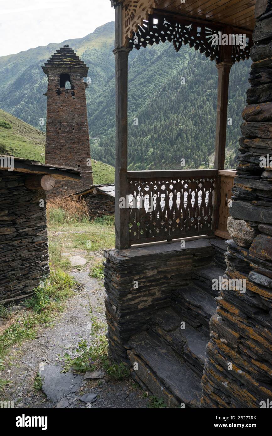 Stone tower. Wooden entrance to old house. Architecture of Tusheti ...