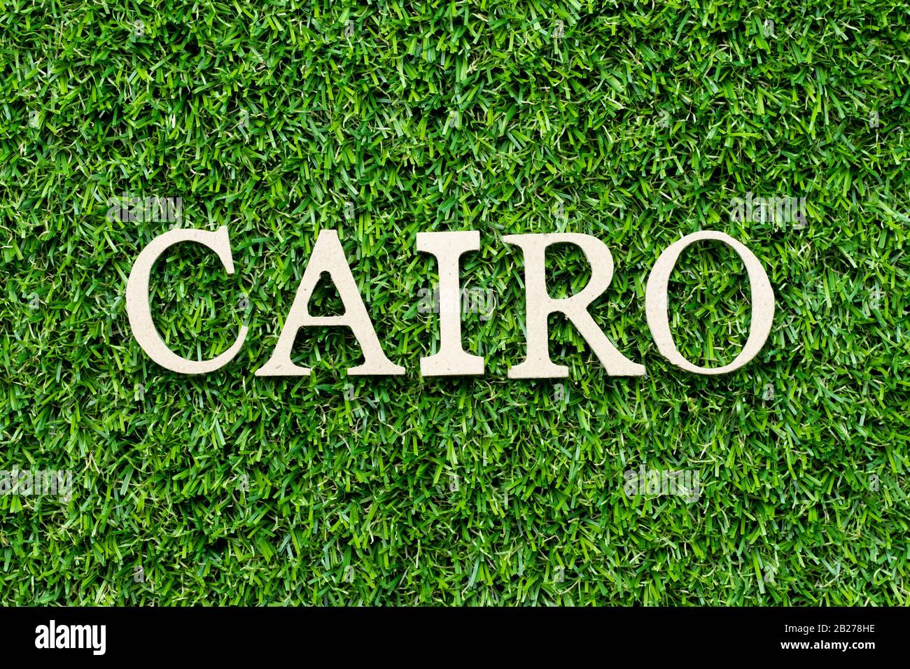 Wood alphabet letter in word Cairo on green grass background Stock ...