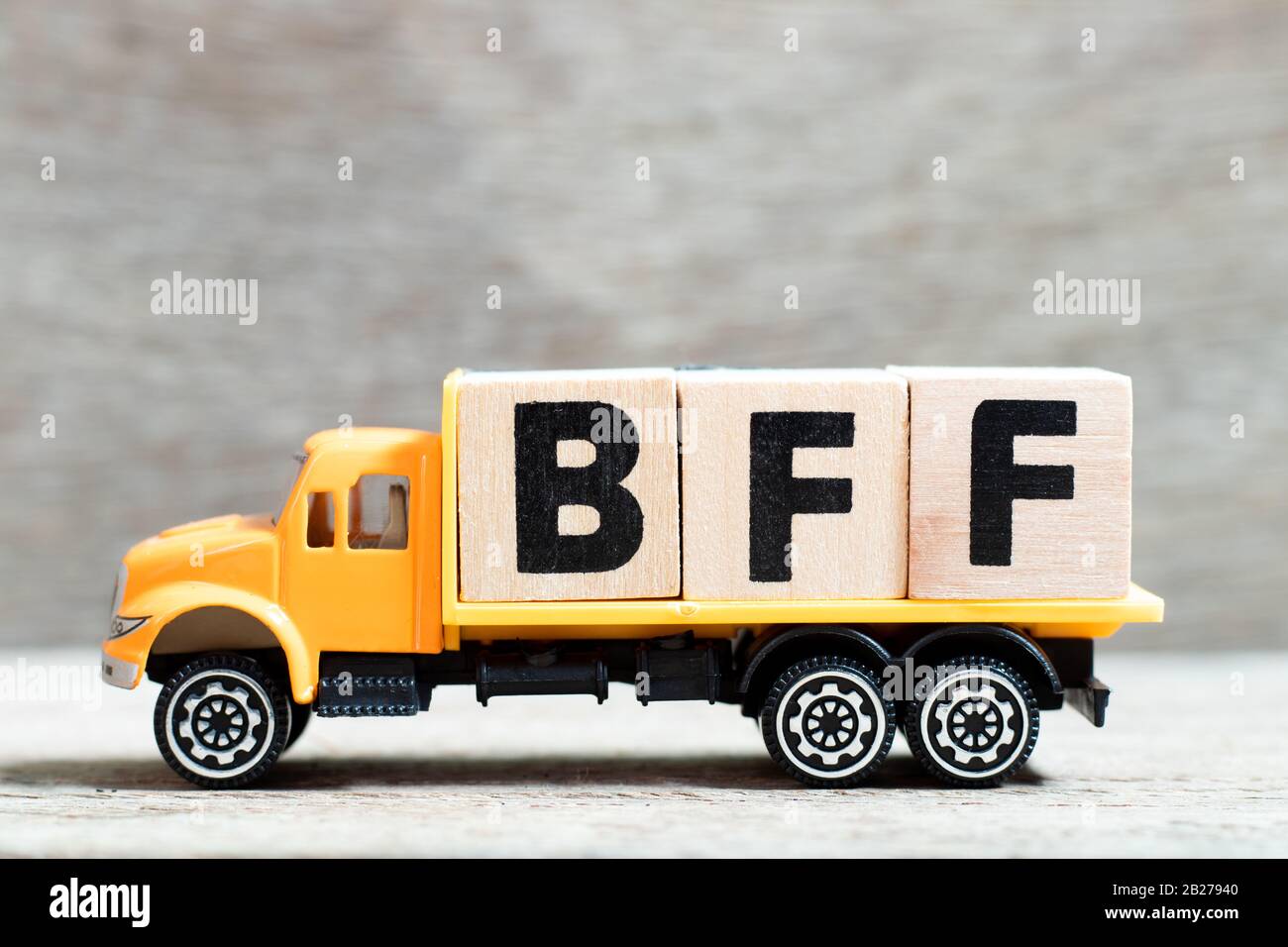 Truck hold letter block in word BFF (Abbreviation of best friend ...