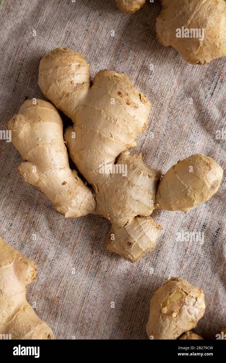 Raw Organic Ginger Root on cloth, top view. Flat lay, from above ...
