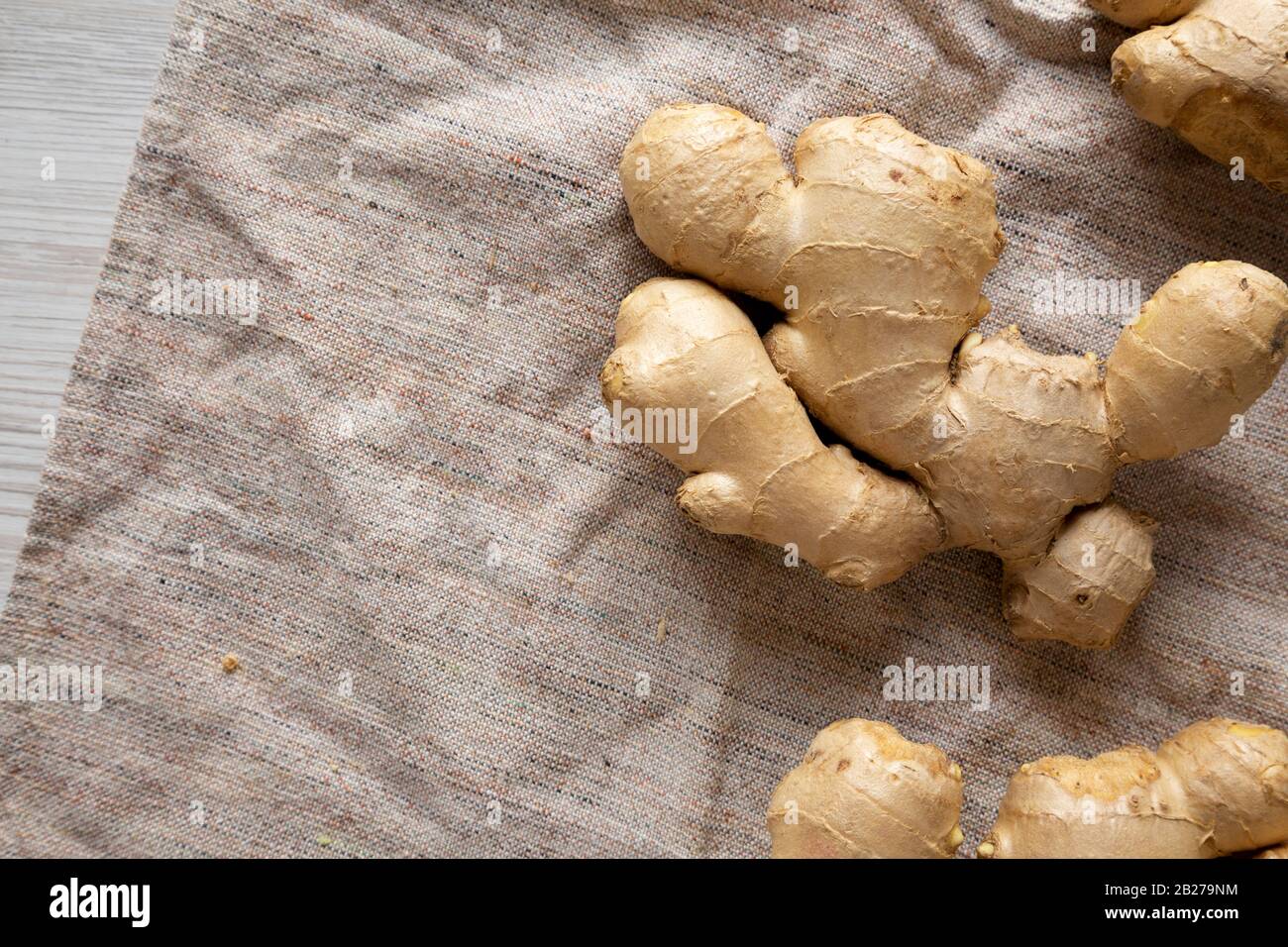 Raw Organic Ginger Root on cloth, overhead view. Flat lay, top view ...